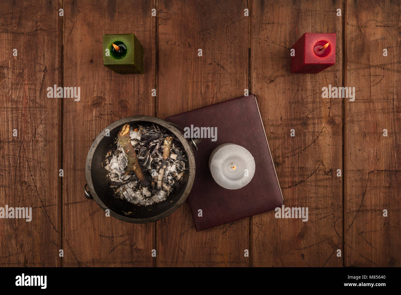 An overhead photo of a witch's cauldron, a grimoire, candles. Wicca ...