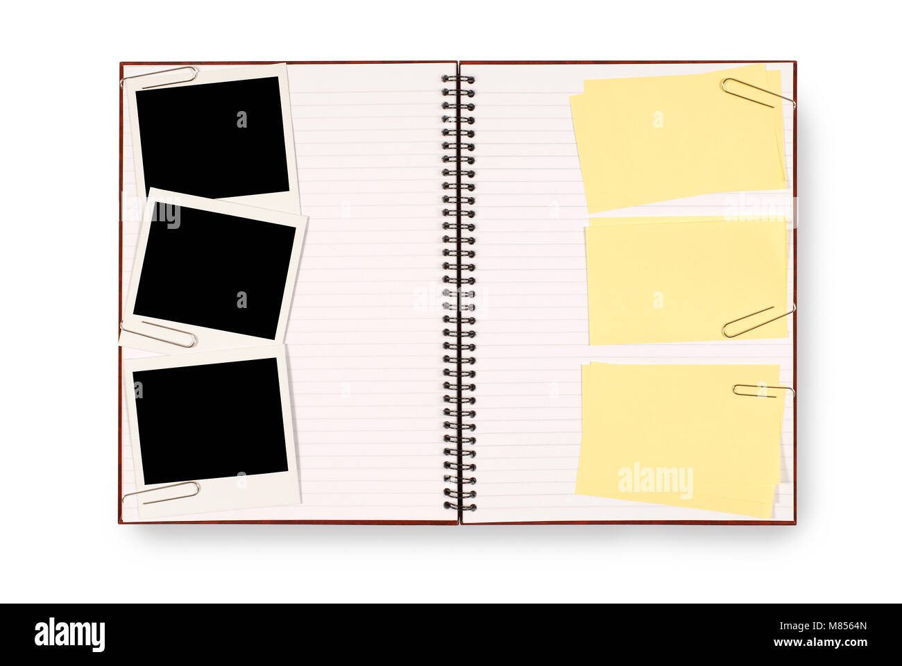 Writing book or scrapbook with various sticky notes and blank instant ...
