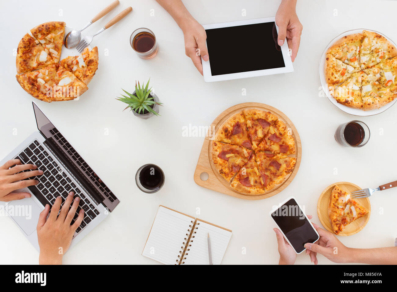Lunch and people concept. Happy business team eating pizza in office ...