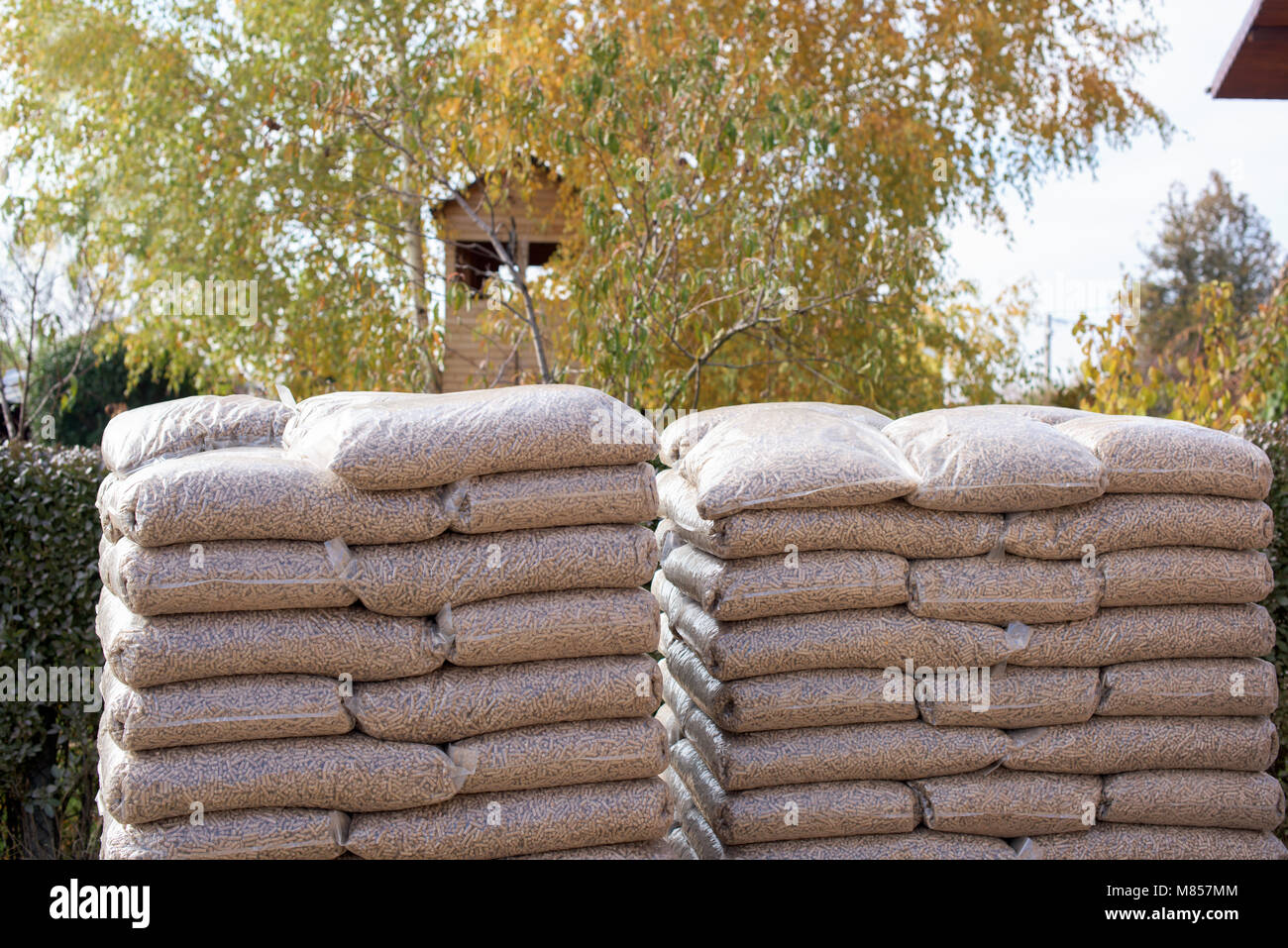Two big piles with sacks with biomass in front yard Stock Photo - Alamy