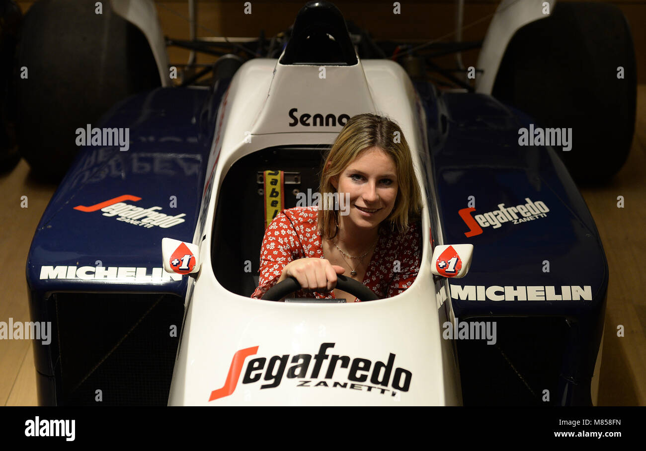A Bonhams employee sits in the 1984 turbocharged Formula 1 Toleman-Hart ...