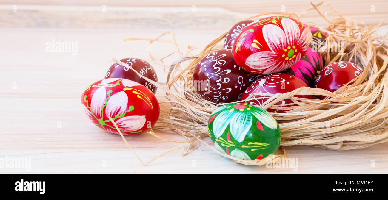 Easter eggs festive painted, decorative eggs on a straw nest Stock ...