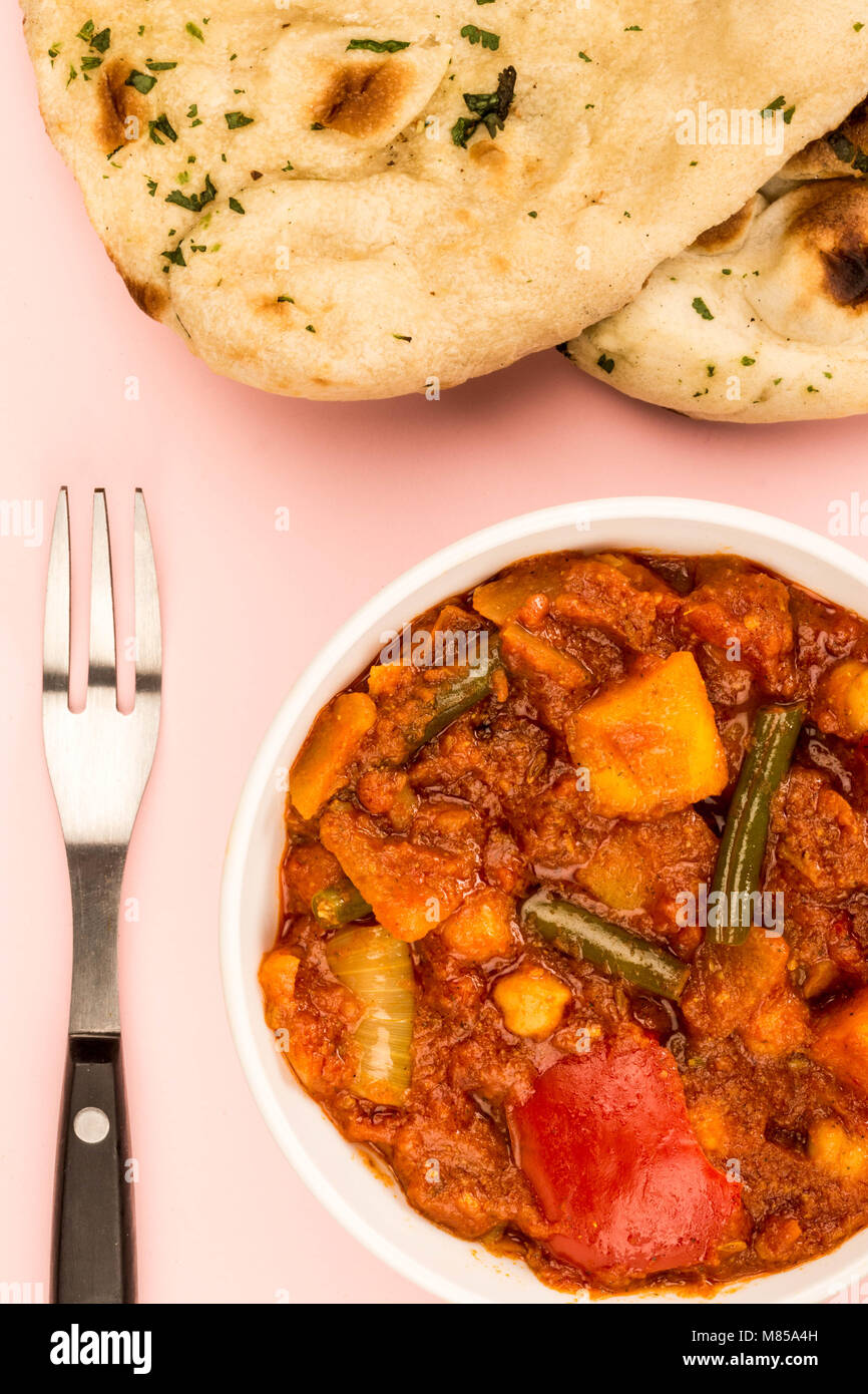 Indian Style Vegetarian Masala Curry Against A Pink Background With ...