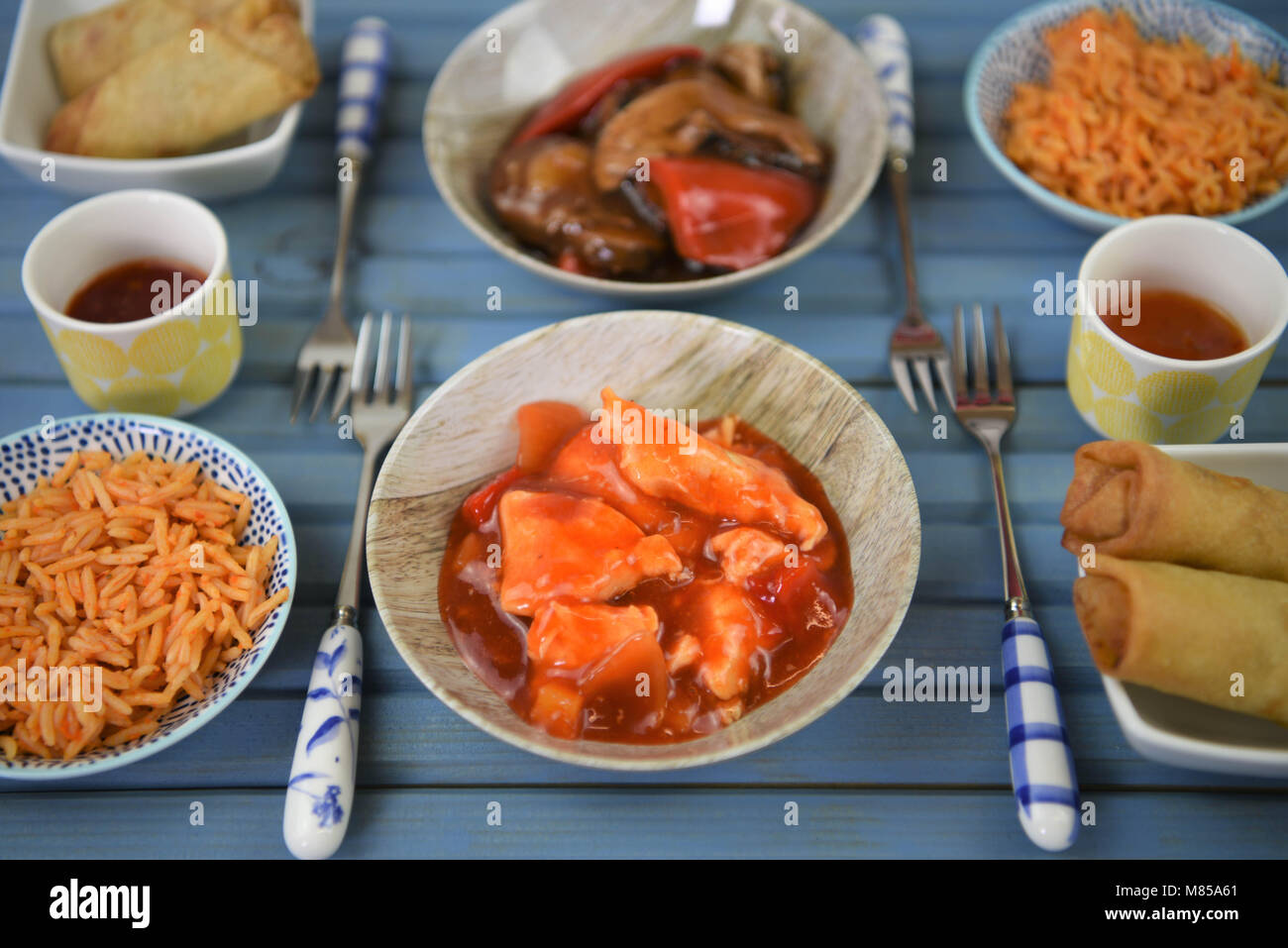 Chinese take away night with food in dishes cooked and served on a ...