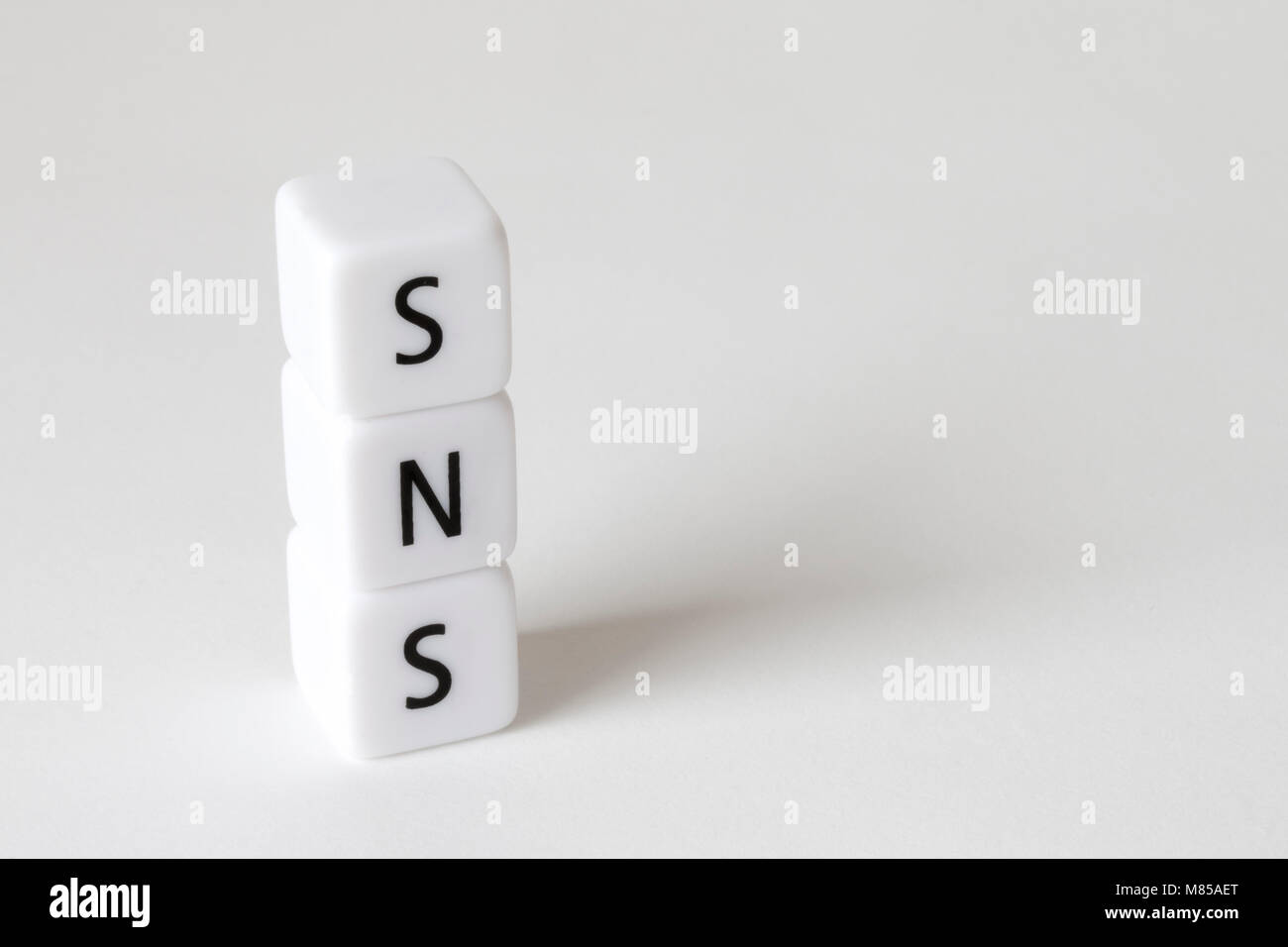 White cube written as SNS Stock Photo - Alamy