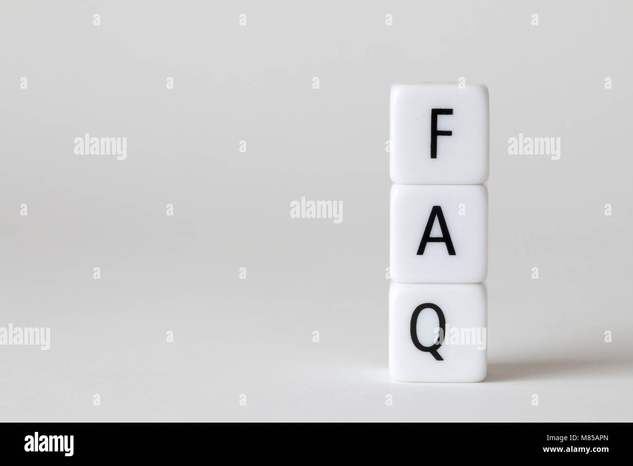 White cube written as FAQ Stock Photo - Alamy