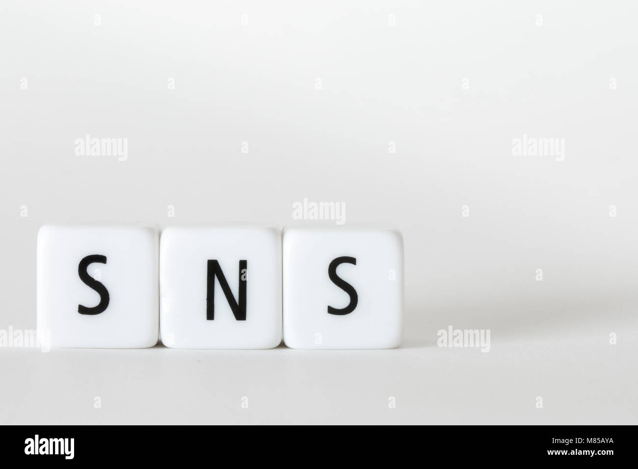 White cube written as SNS Stock Photo - Alamy