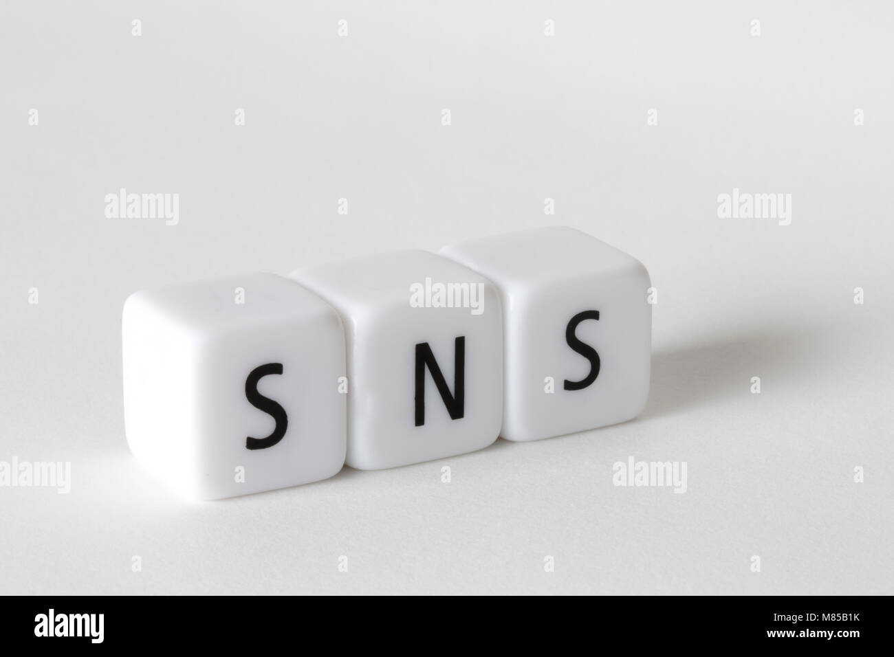 White cube written as SNS Stock Photo - Alamy