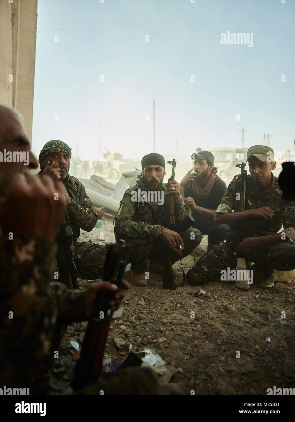 YPG soldiers gather at a forward operating base on the Western front ...