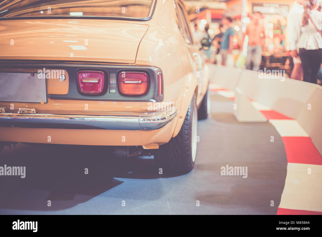 Back of vintage car on the road Stock Photo - Alamy
