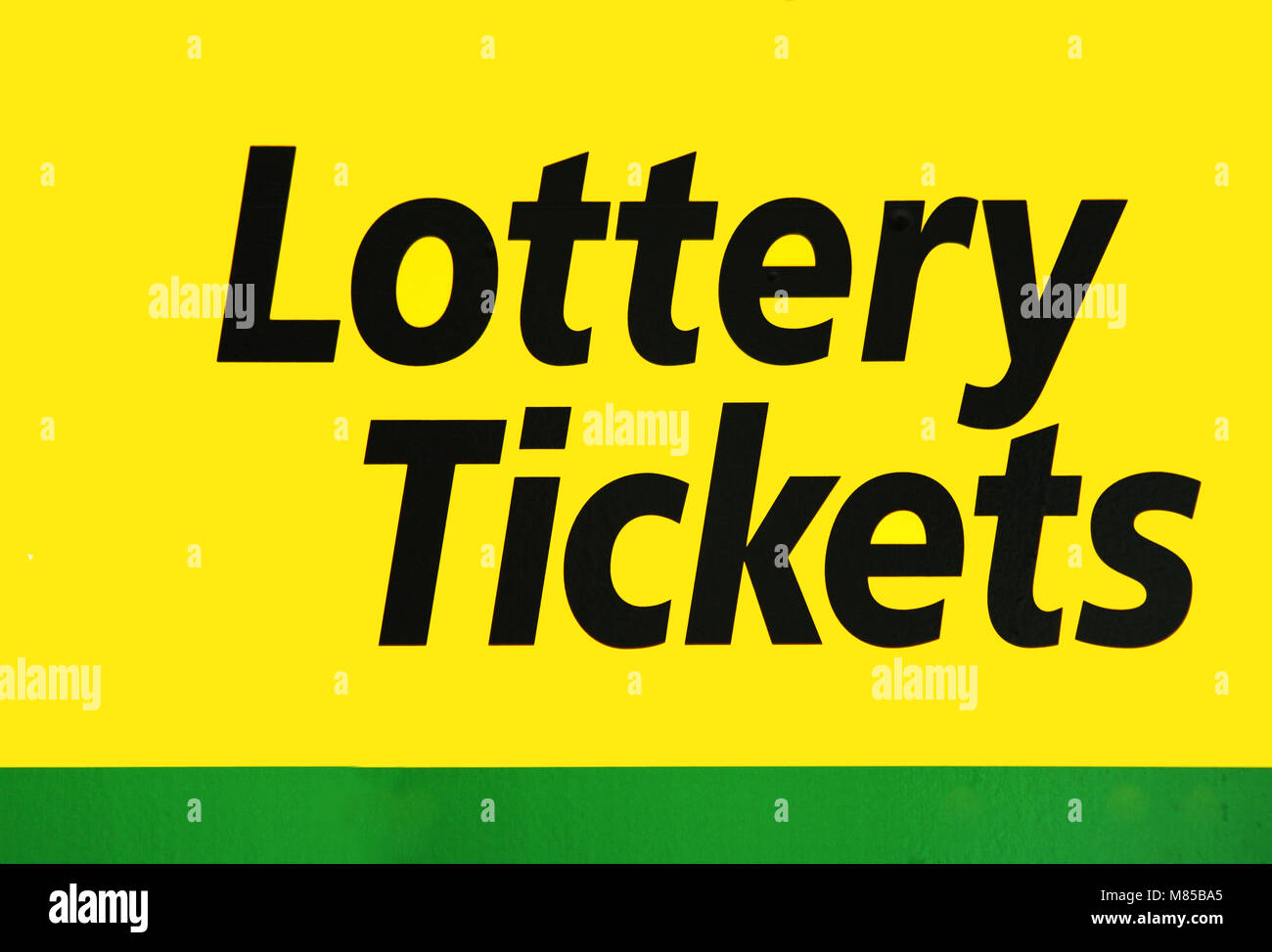 A yellow lottery tickets sign Stock Photo - Alamy
