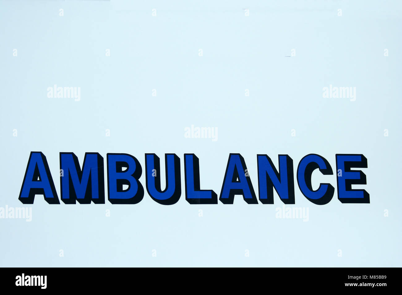 A Ambulance sign on a empty background Stock Photo - Alamy