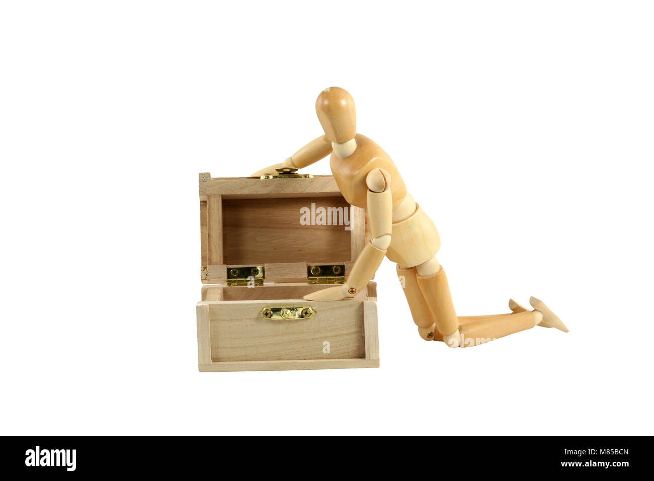 A Wooden manikin opening treasure chest Stock Photo - Alamy