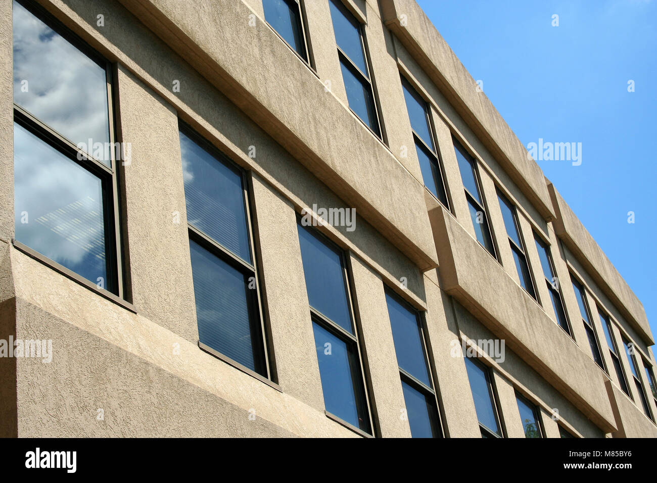 Office building windows with blue sky Stock Photo - Alamy