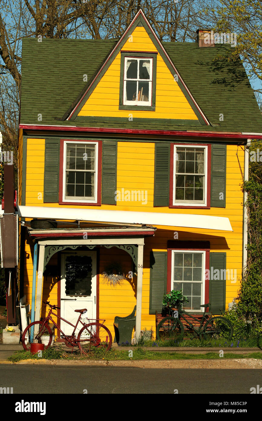 A colorful yellow house image Stock Photo - Alamy