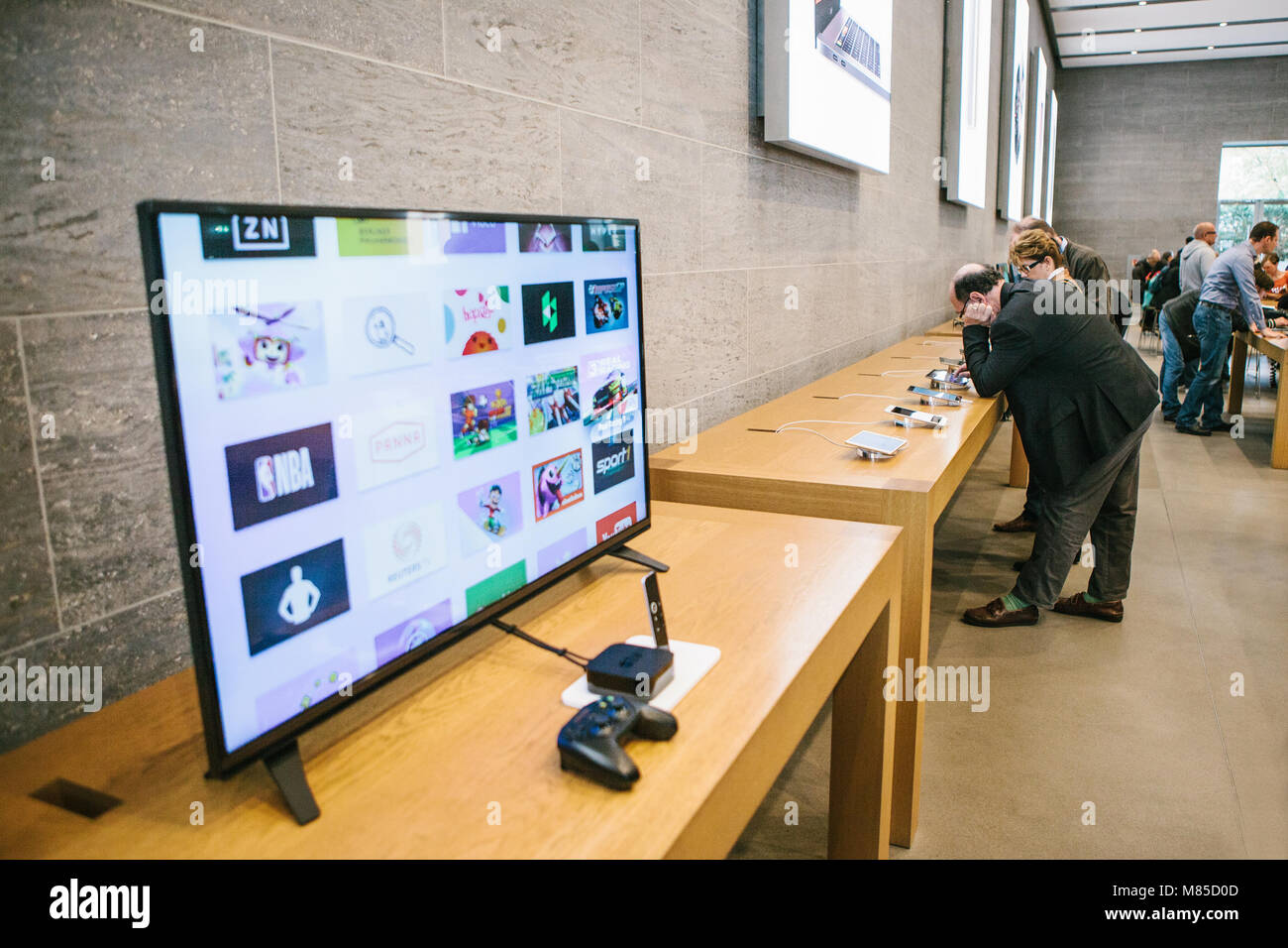 Presentation of new Apple products in the official Apple store. Buyers ...