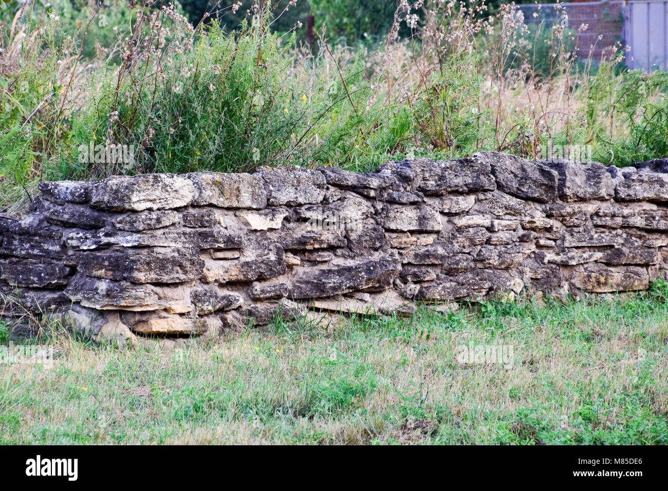 An old ruined wall made of rubble Stock Photo - Alamy