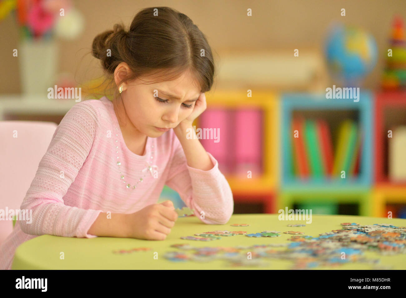 girl collecting puzzles Stock Photo - Alamy