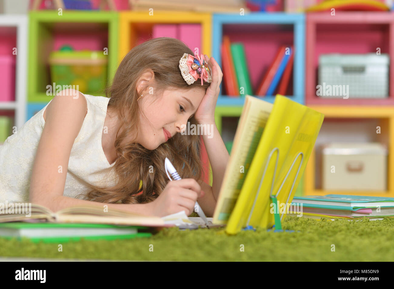 little cute girl doing homework Stock Photo - Alamy