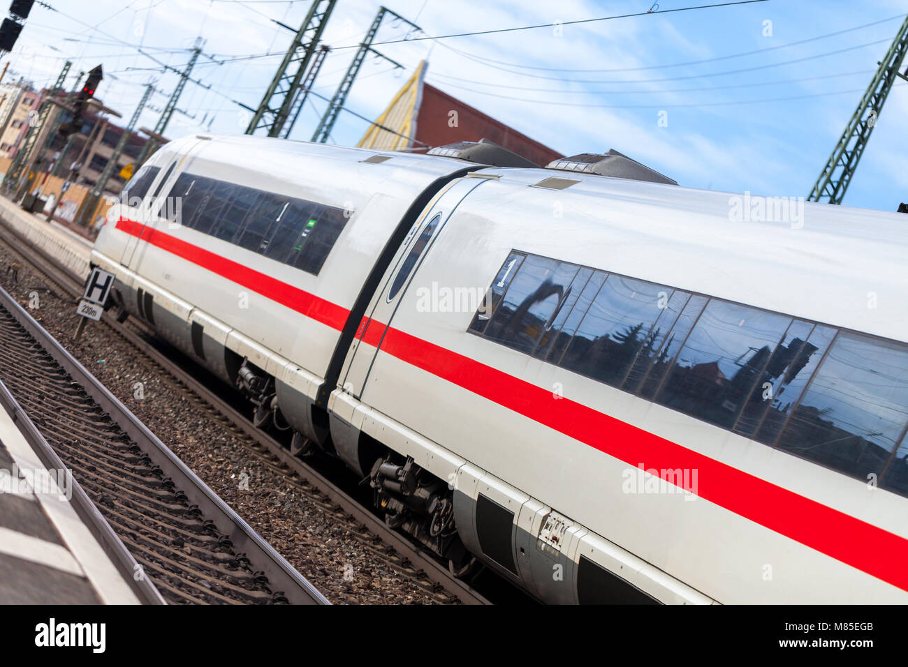 a german train passes a train station Stock Photo - Alamy