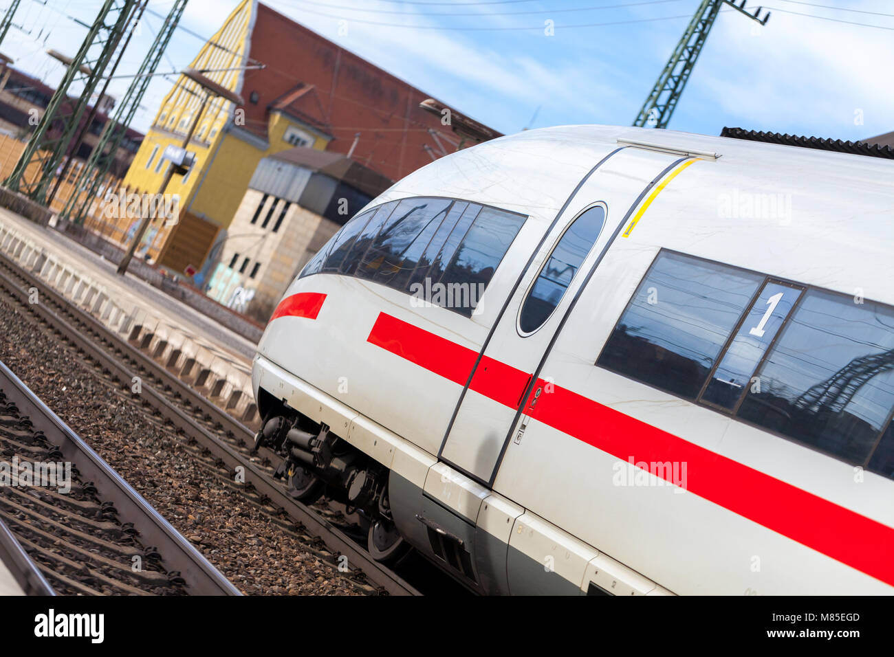a german train passes a train station Stock Photo - Alamy