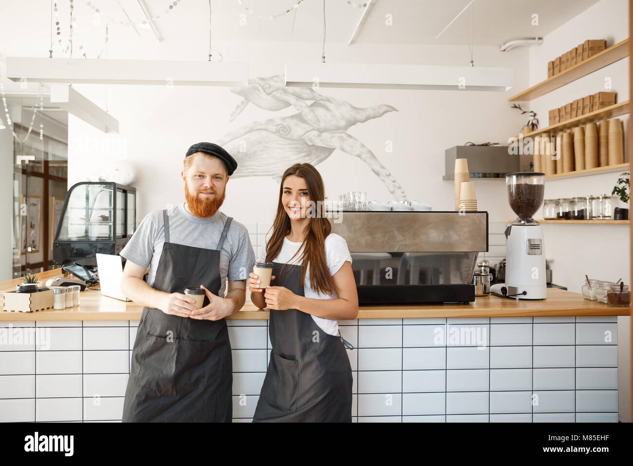 Business partners at counter of coffee shop hi-res stock photography ...