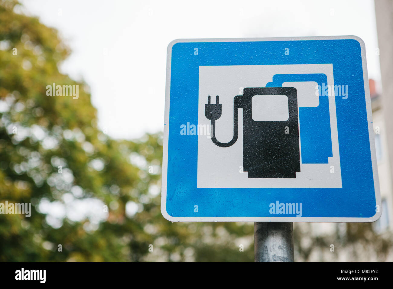 A sign indicating a special place for refueling electric vehicles. A ...