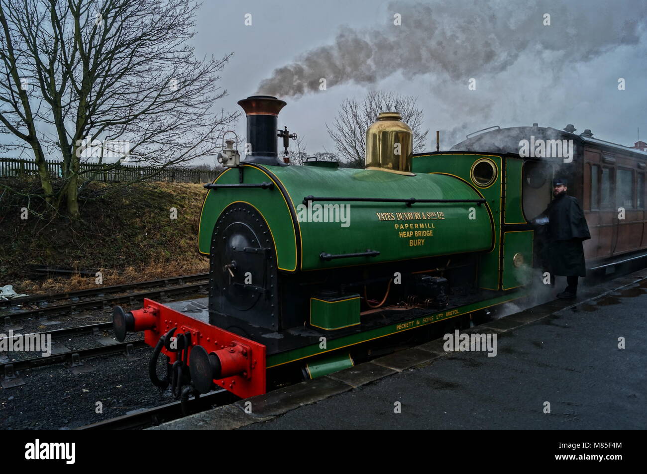 Awaiting the Steam Train at Beamish. The Guard,in period costume is ...