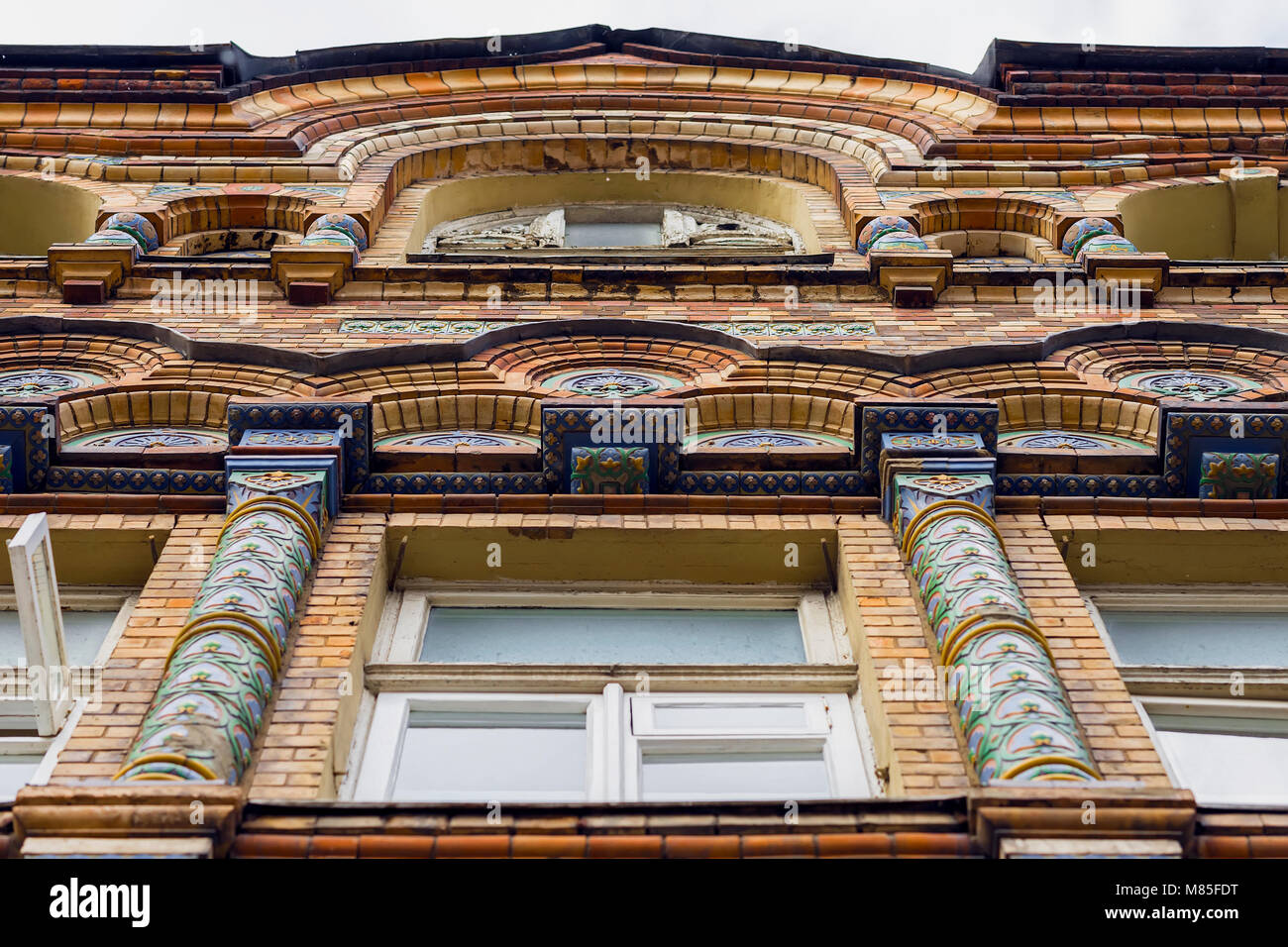 Bottom view of old, historical building. Front window of structure ...