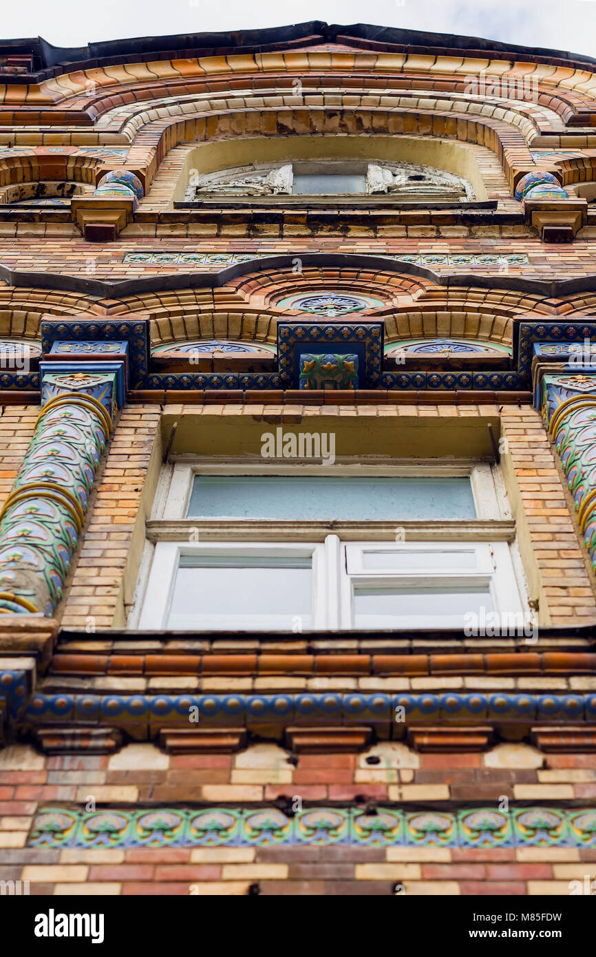 Bottom view window of old, historical building. Front of structure ...