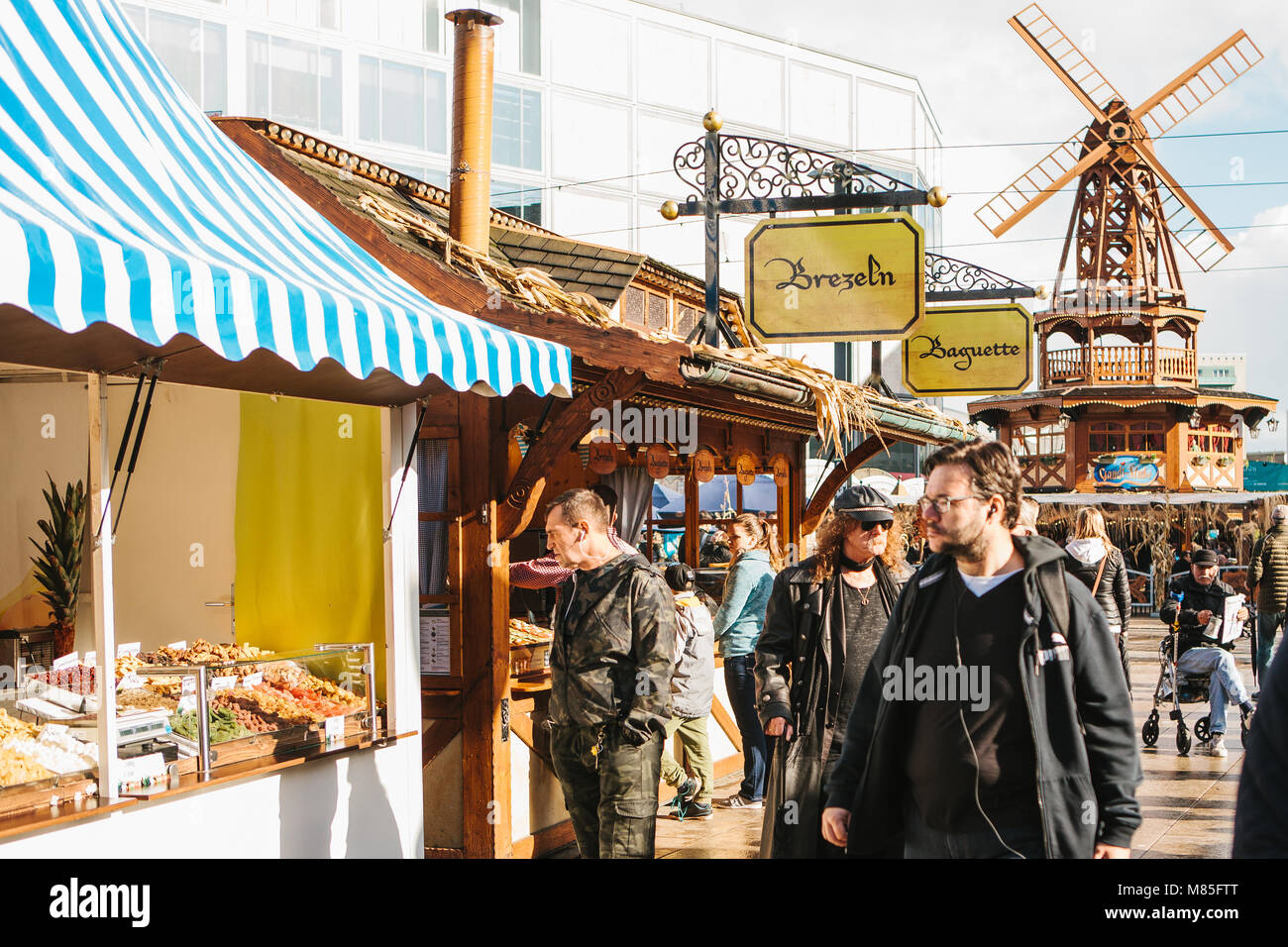 Celebrating the Oktoberfest. People walk on the street market on the ...
