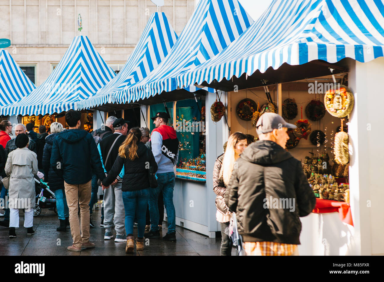 Celebrating the Oktoberfest. People walk on the street market on the ...