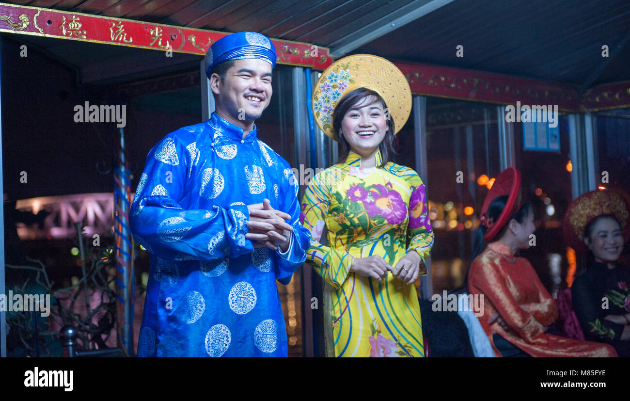 Vietnamese traditional singers, male and female on a boat. Hue. VIETNAM ...