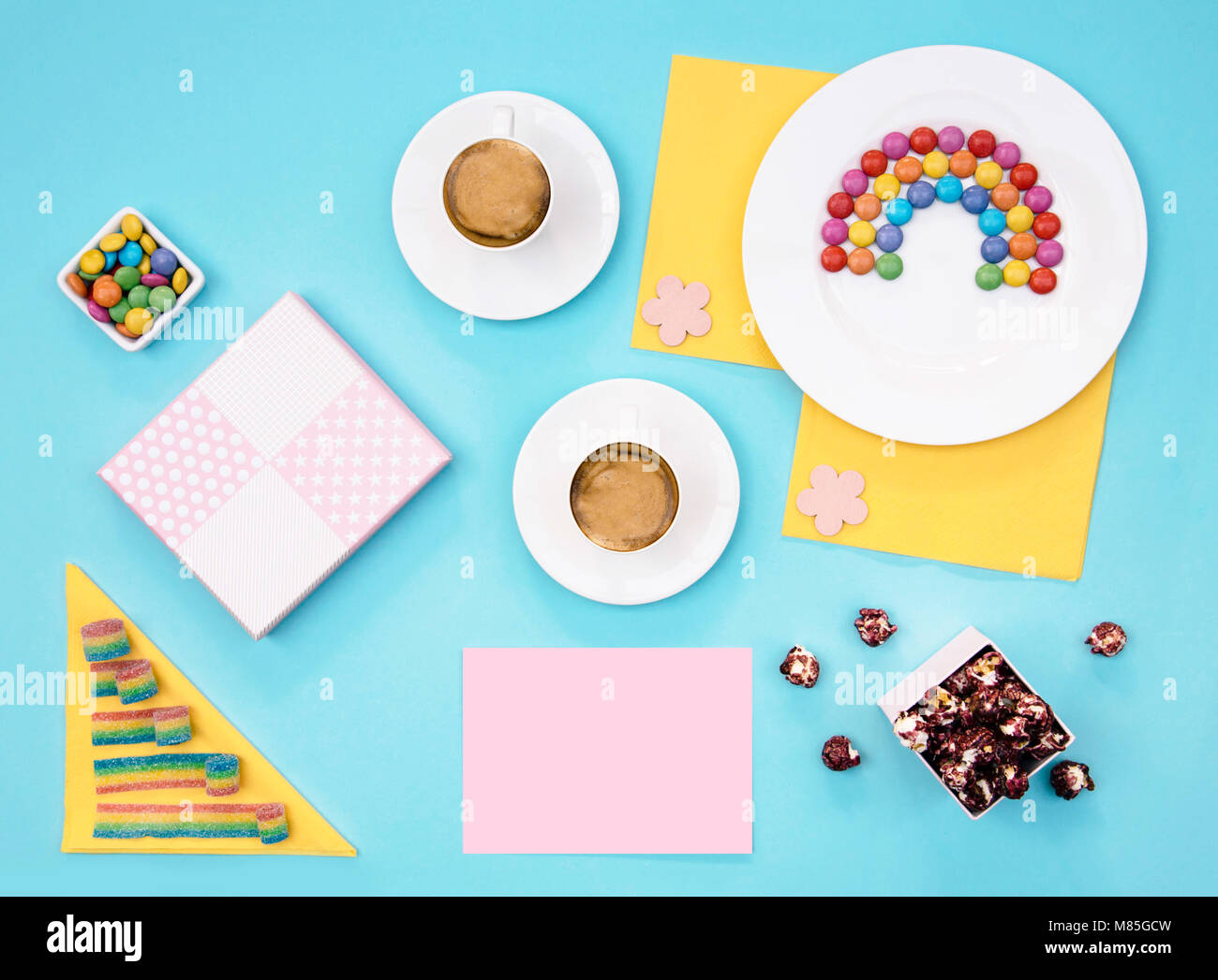 Colorful still life with sweets and present on blue background Stock ...
