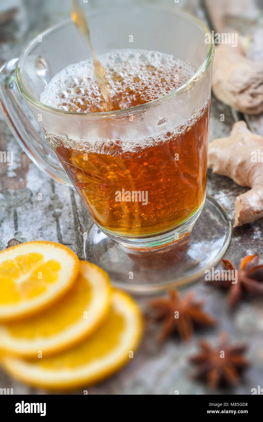 Arabic tea in traditional glass with mint, cinnamon, anise stars on ...