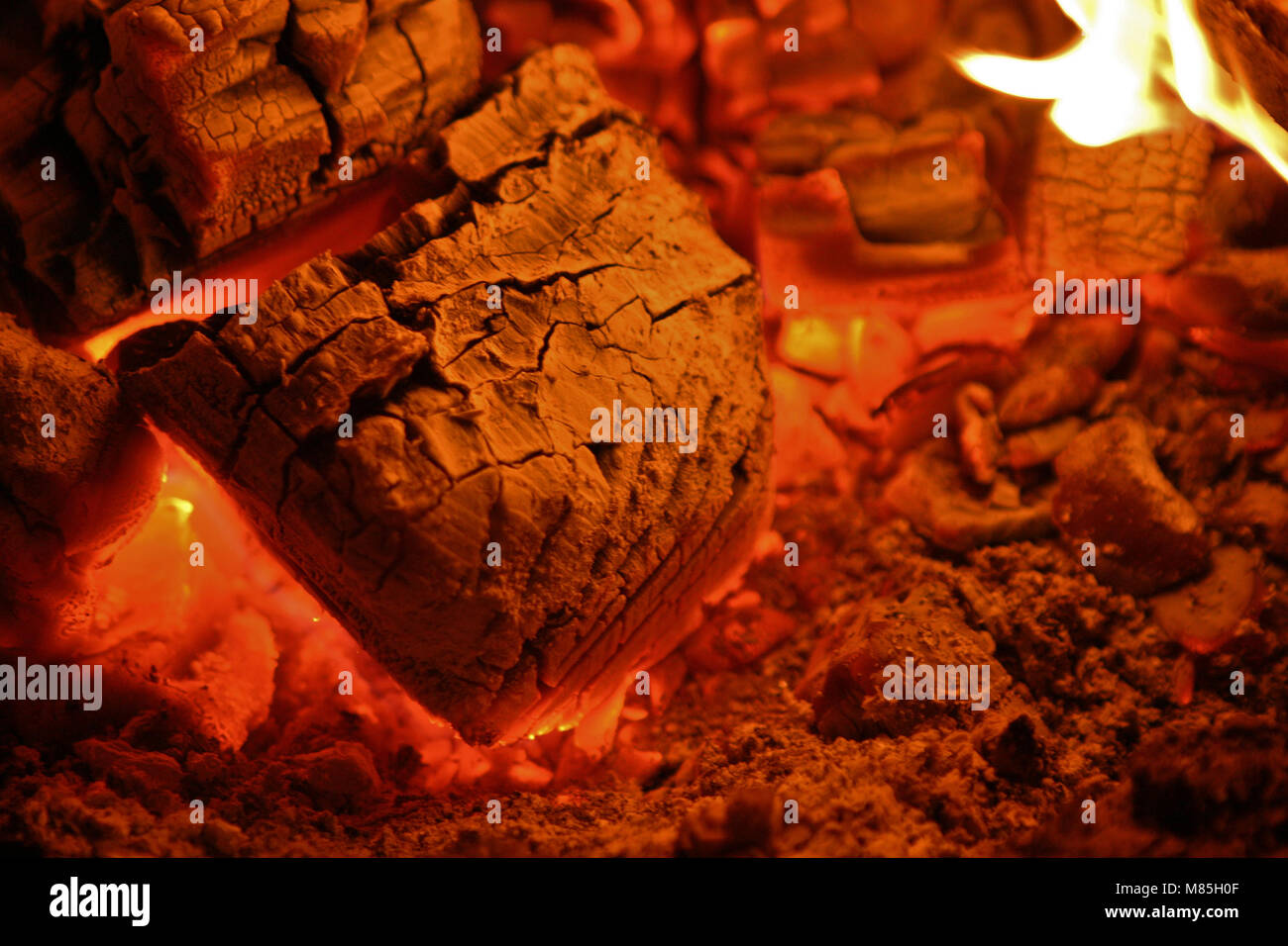red hot coals glowing inside a wood stove Stock Photo - Alamy