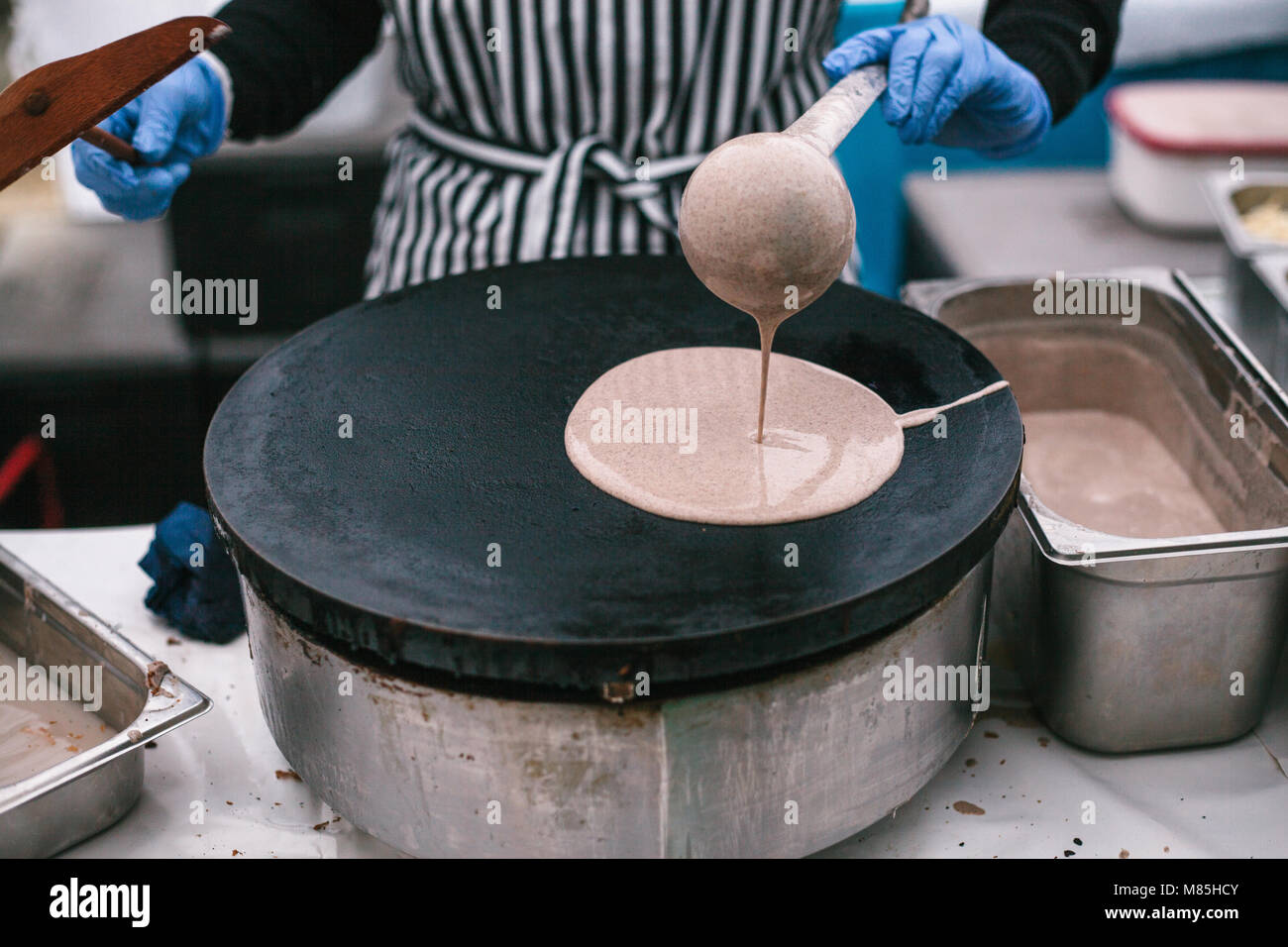 Cooking pancakes in the pan at the bakery. The chef at work. Street ...