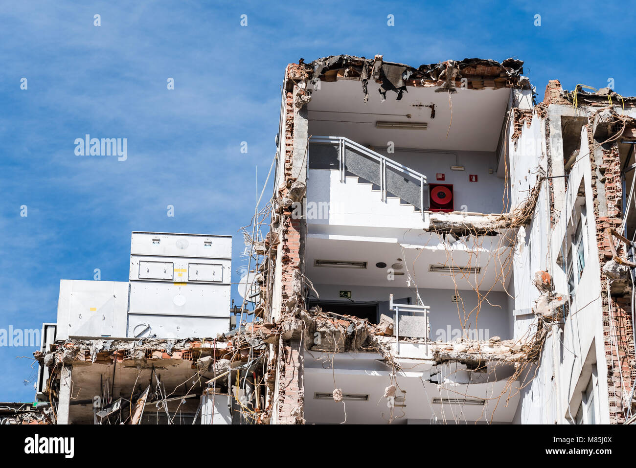 Demolition work of office building in Madrid Stock Photo - Alamy