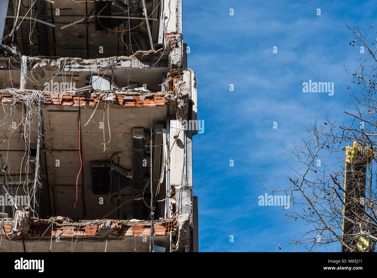 Demolition work of office building in Madrid Stock Photo - Alamy
