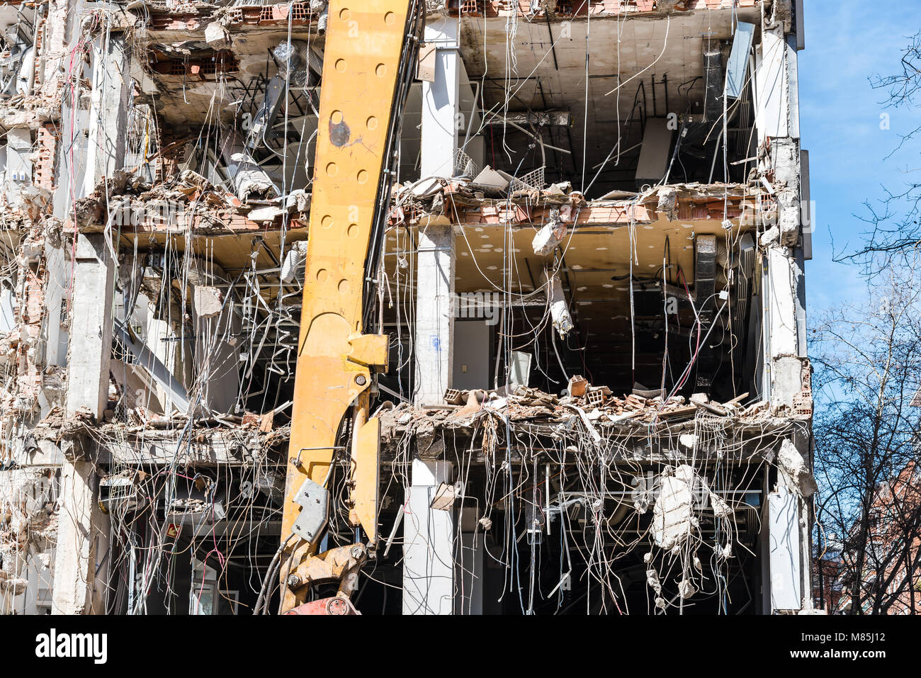 Demolition work of office building in Madrid Stock Photo - Alamy