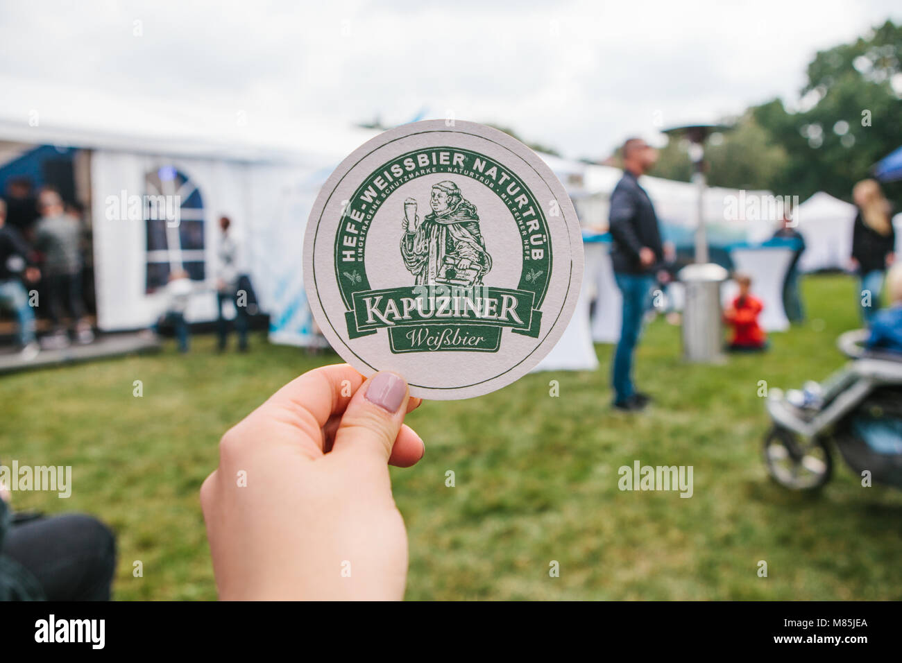 Prague, September 23, 2017: The girl is holding a beer stand with the ...