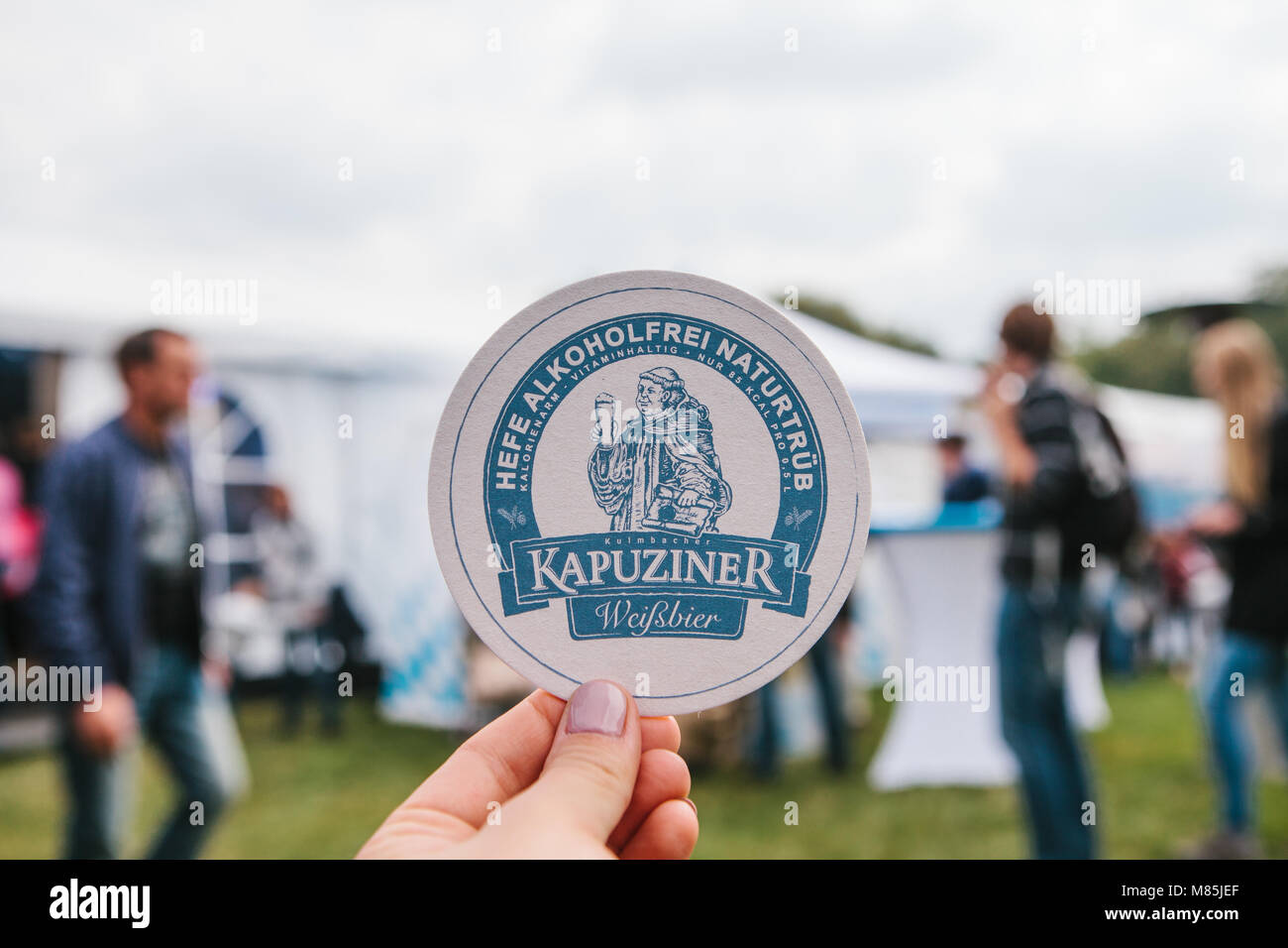 Prague, September 23, 2017: The girl is holding a beer stand with the ...