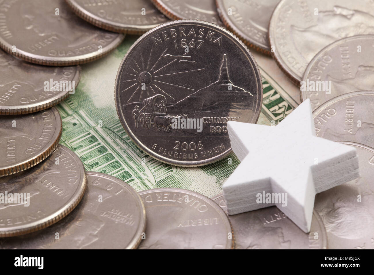 A quarter of Nebraska, quarters of USA and white star. A circle of the ...