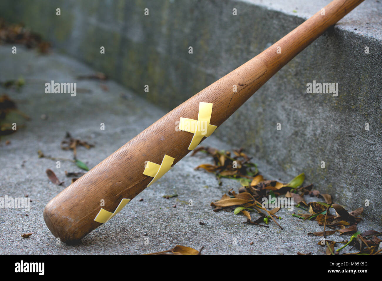 Wooden basketball bat with signs of damage Stock Photo - Alamy