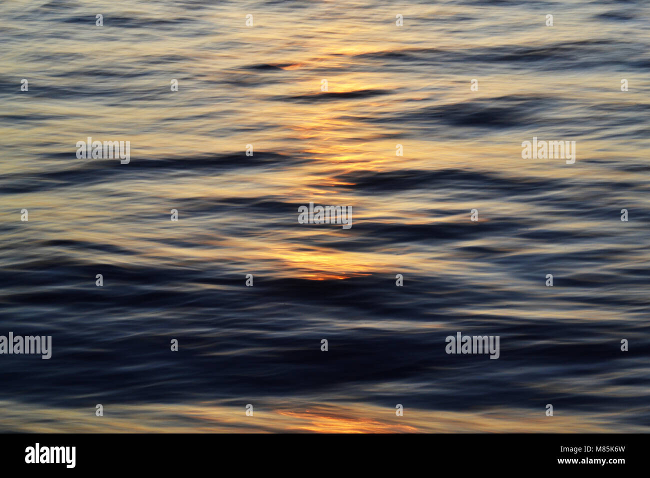 The movement of the water at sunset Stock Photo - Alamy