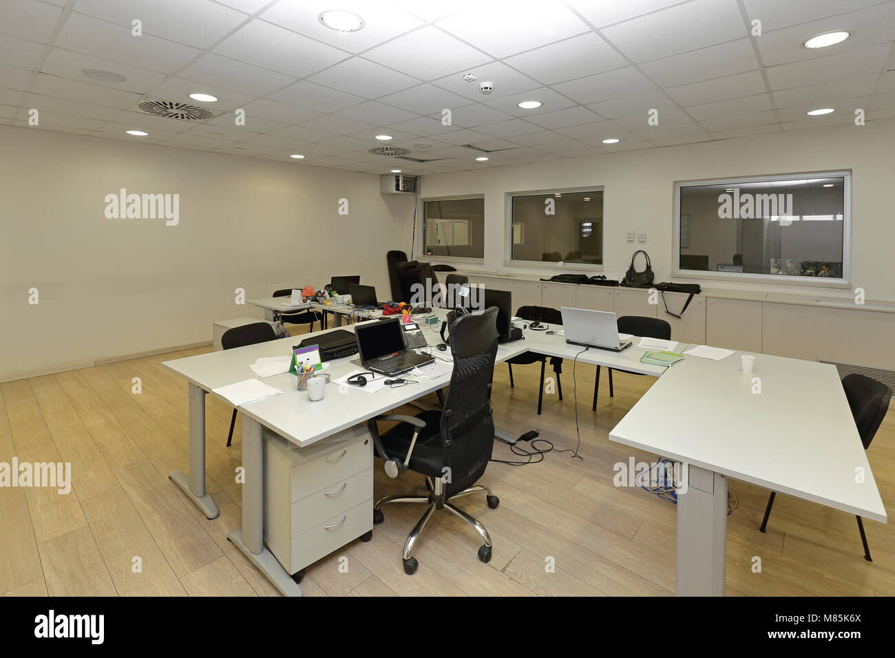 Company Office With Computers at Work Desks Stock Photo - Alamy