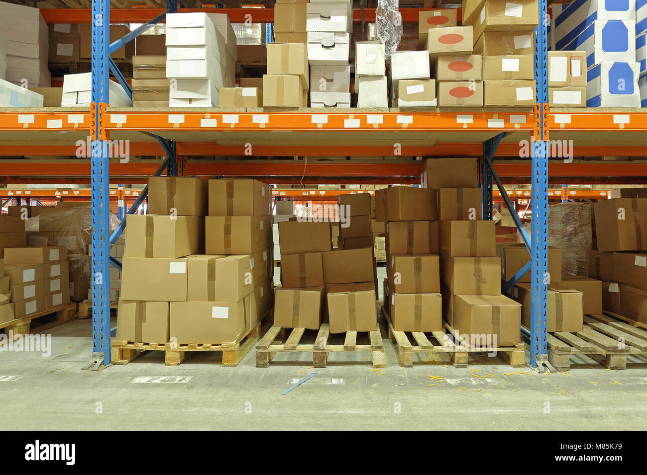 Boxes of Goods at Shelves in Distribution Warehouse Stock Photo - Alamy