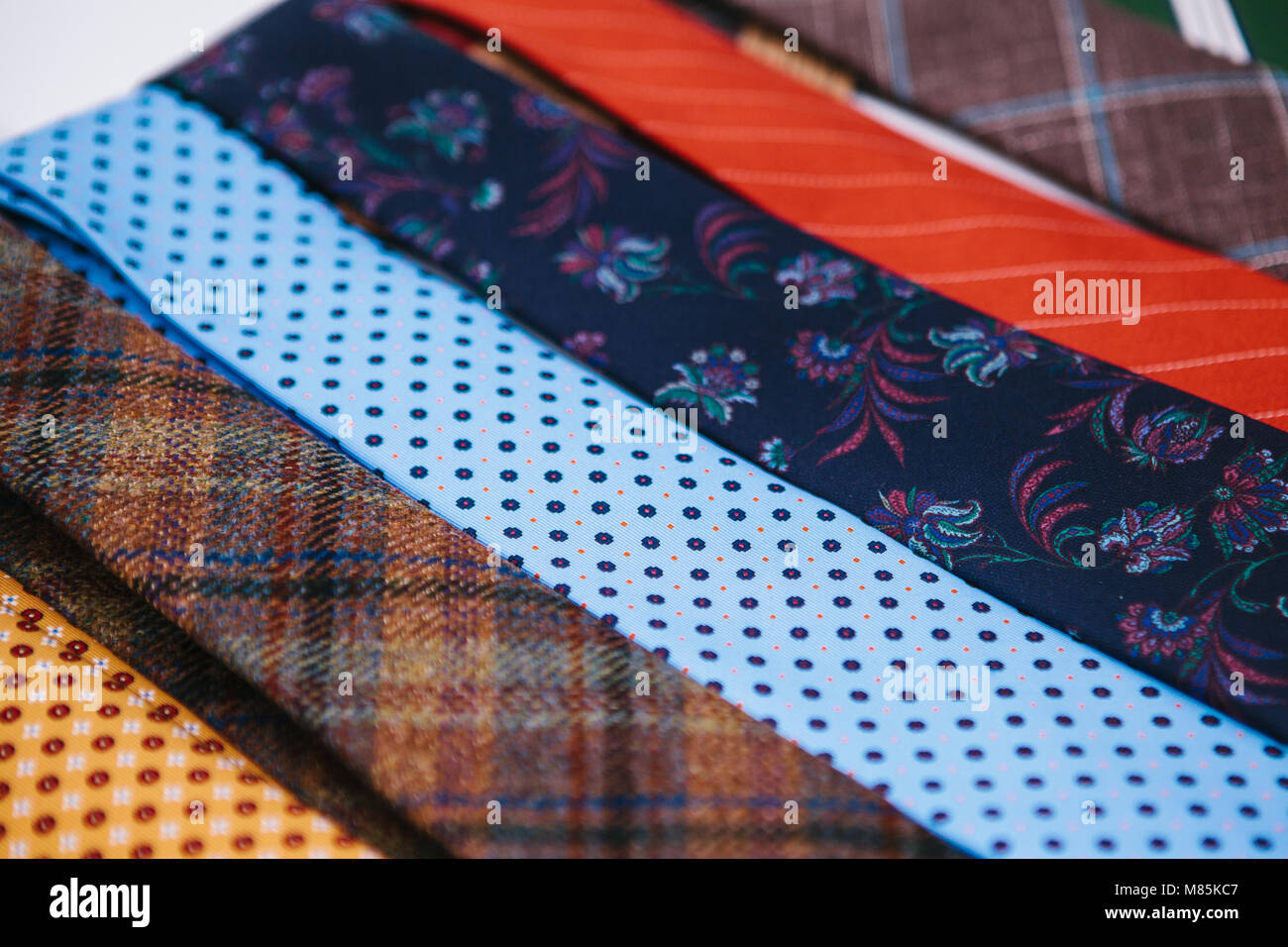 Many multi-colored ties in a row. Supplement to men's clothing in ...