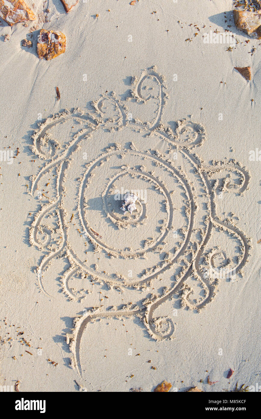 beautiful flower drawn into sand on a beach in thailand on koh samui ...