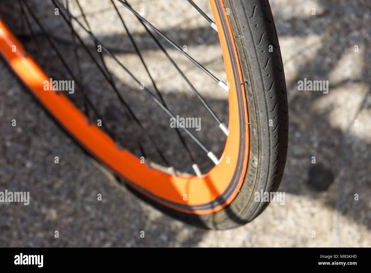 Bicycle wheel old orange color close up Stock Photo - Alamy